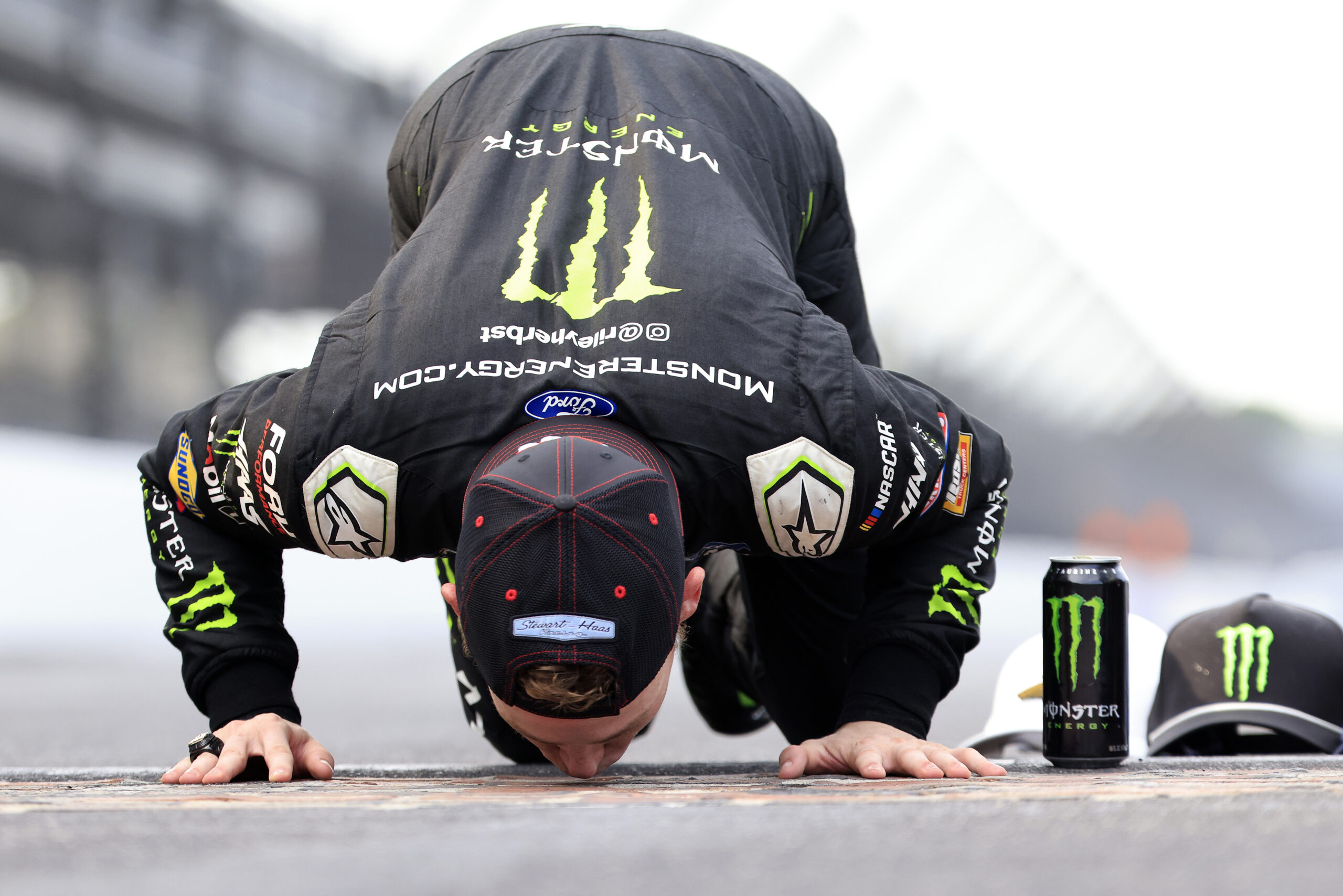 Riley Herbst Kisses the Bricks after a NASCAR Xfinity Series Victory at Indianapolis ...